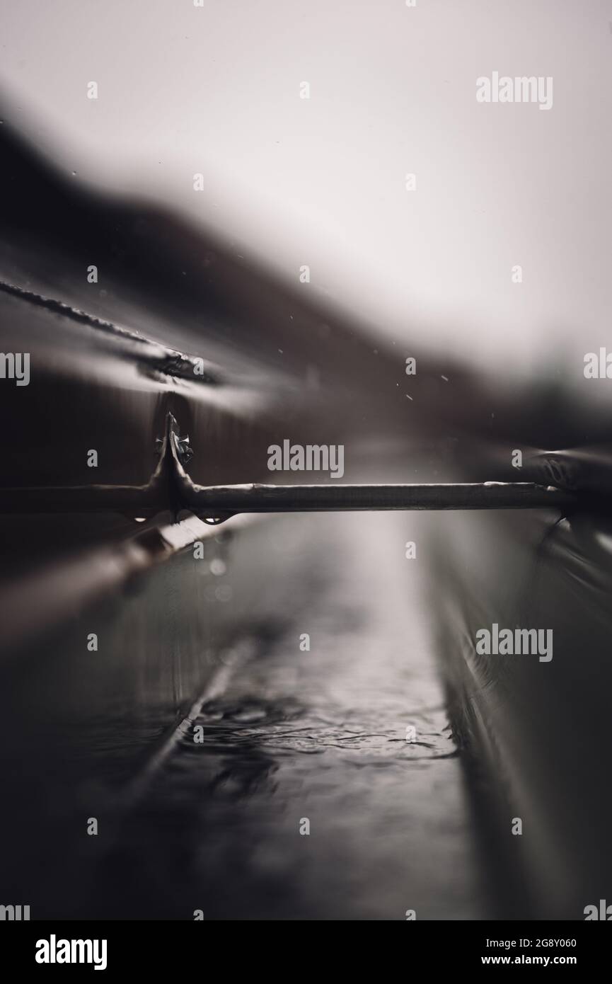 Selective focus on a section of residential guttering with hanger ...