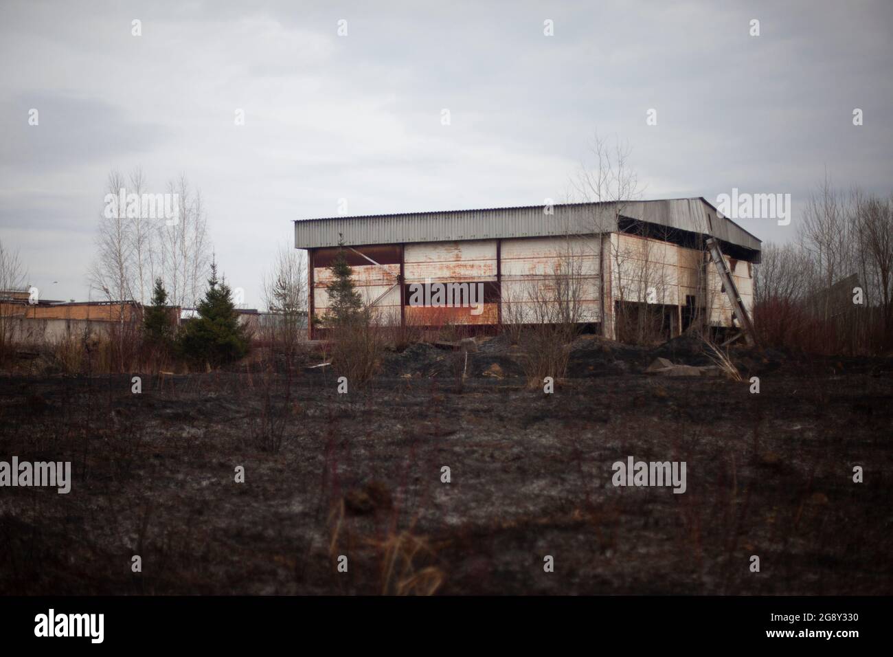 View of an abandoned building. An old warehouse. Rusty building in the ...