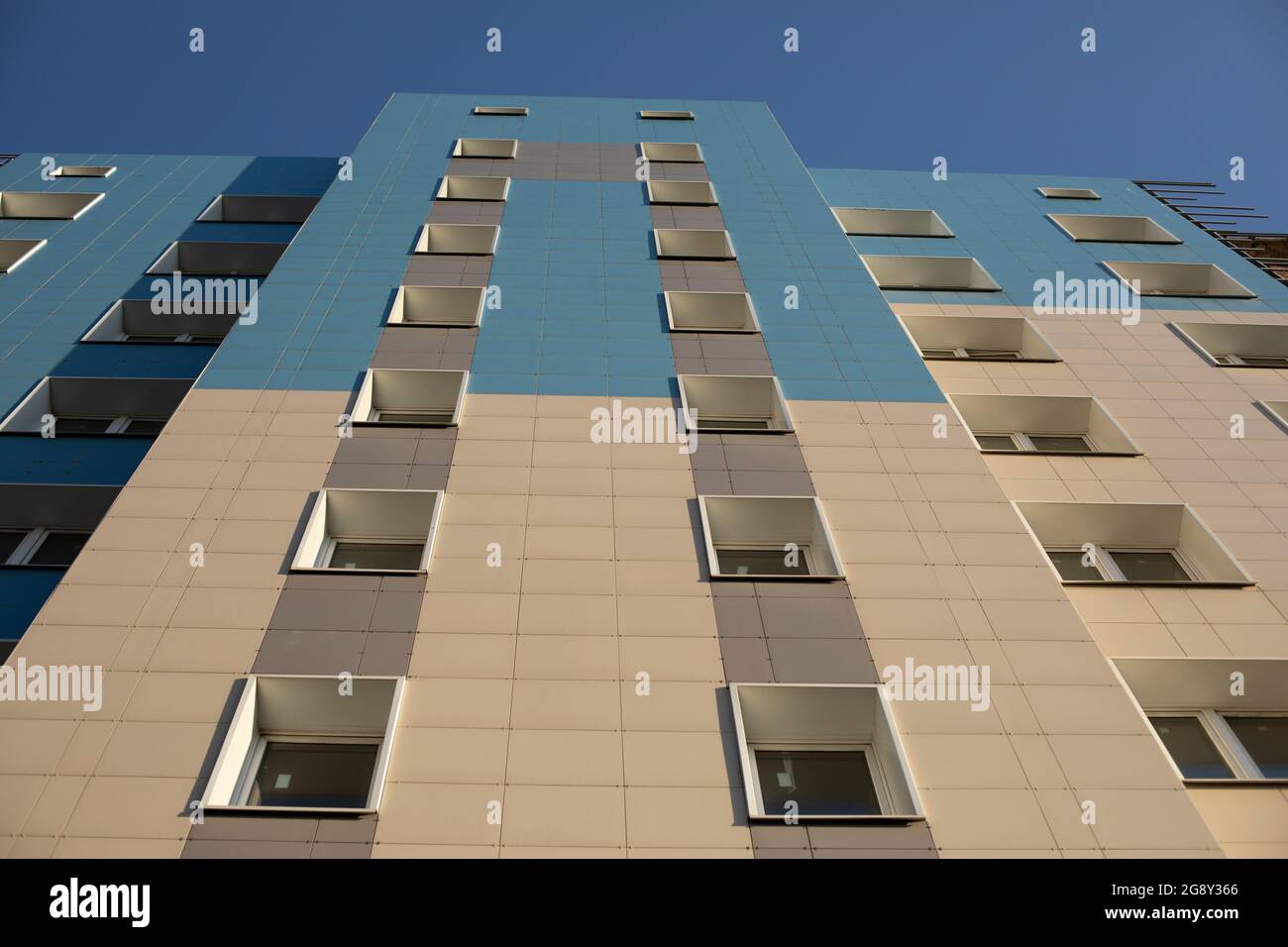 Windows in the building. Bottom view of an apartment building ...