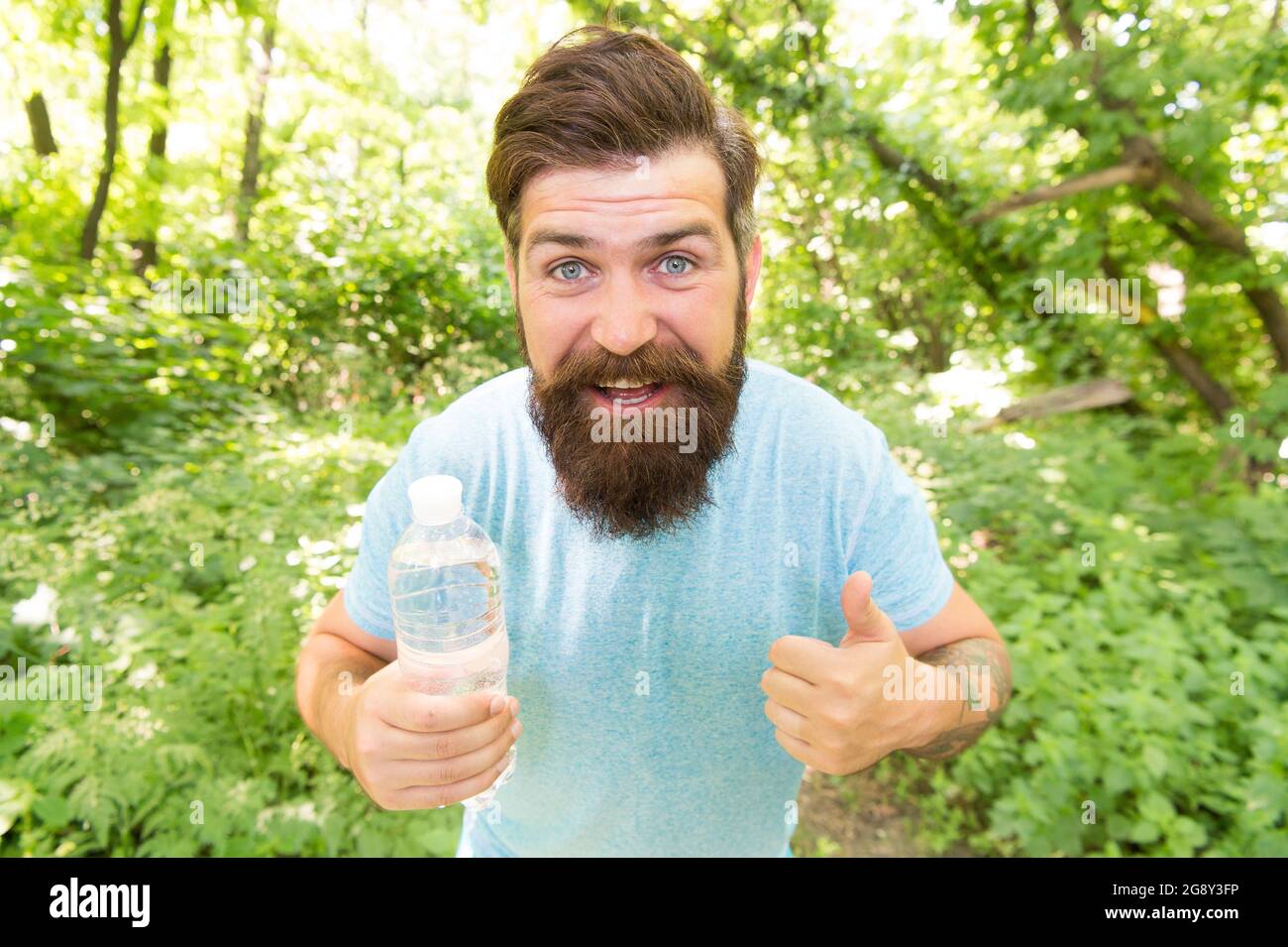 guy maintains body water balance. hydration. daily water. cheerful ...