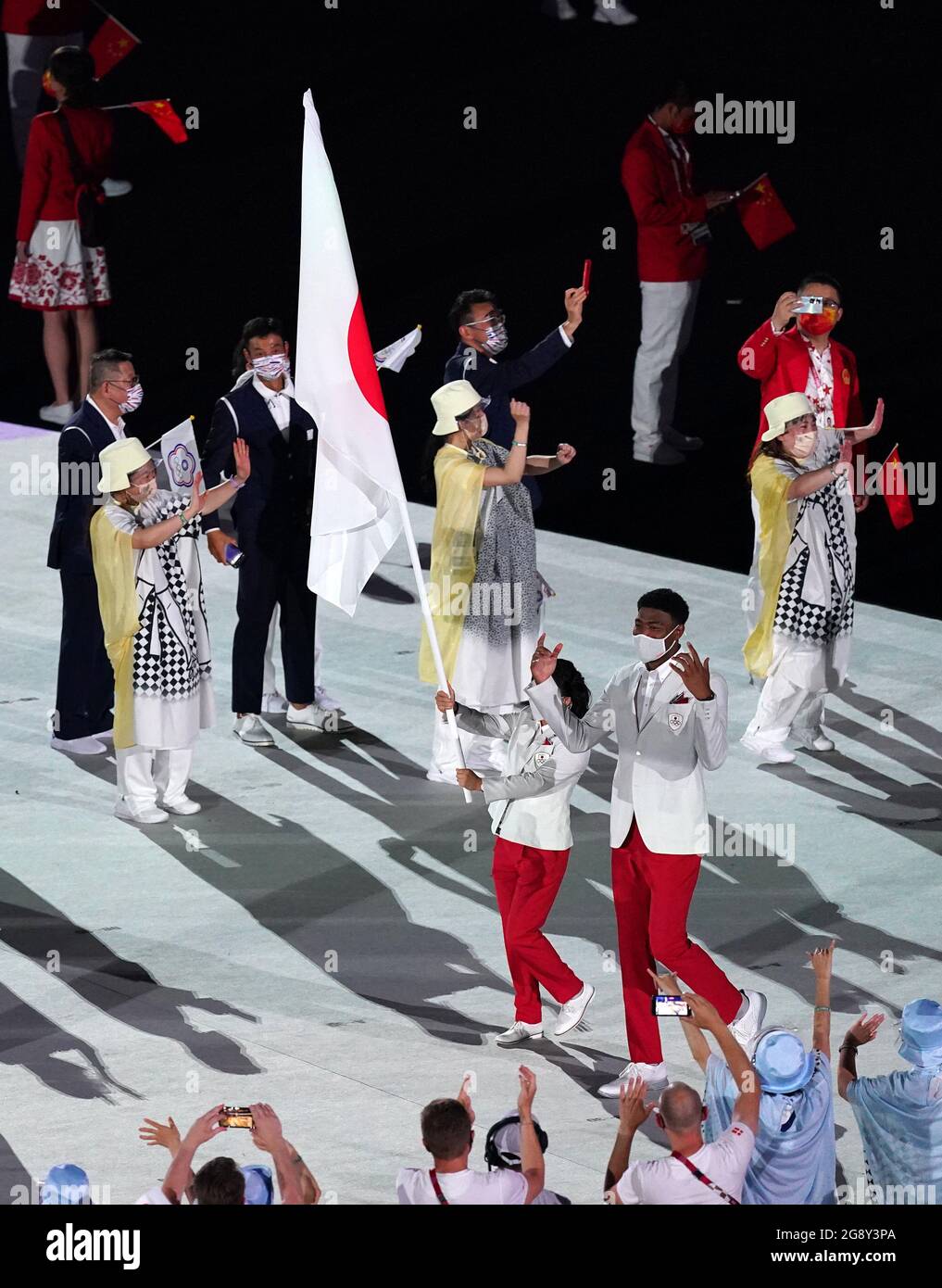 The Japan Olympic team with Yui Susaki and Rui Hachimura carrying the ...
