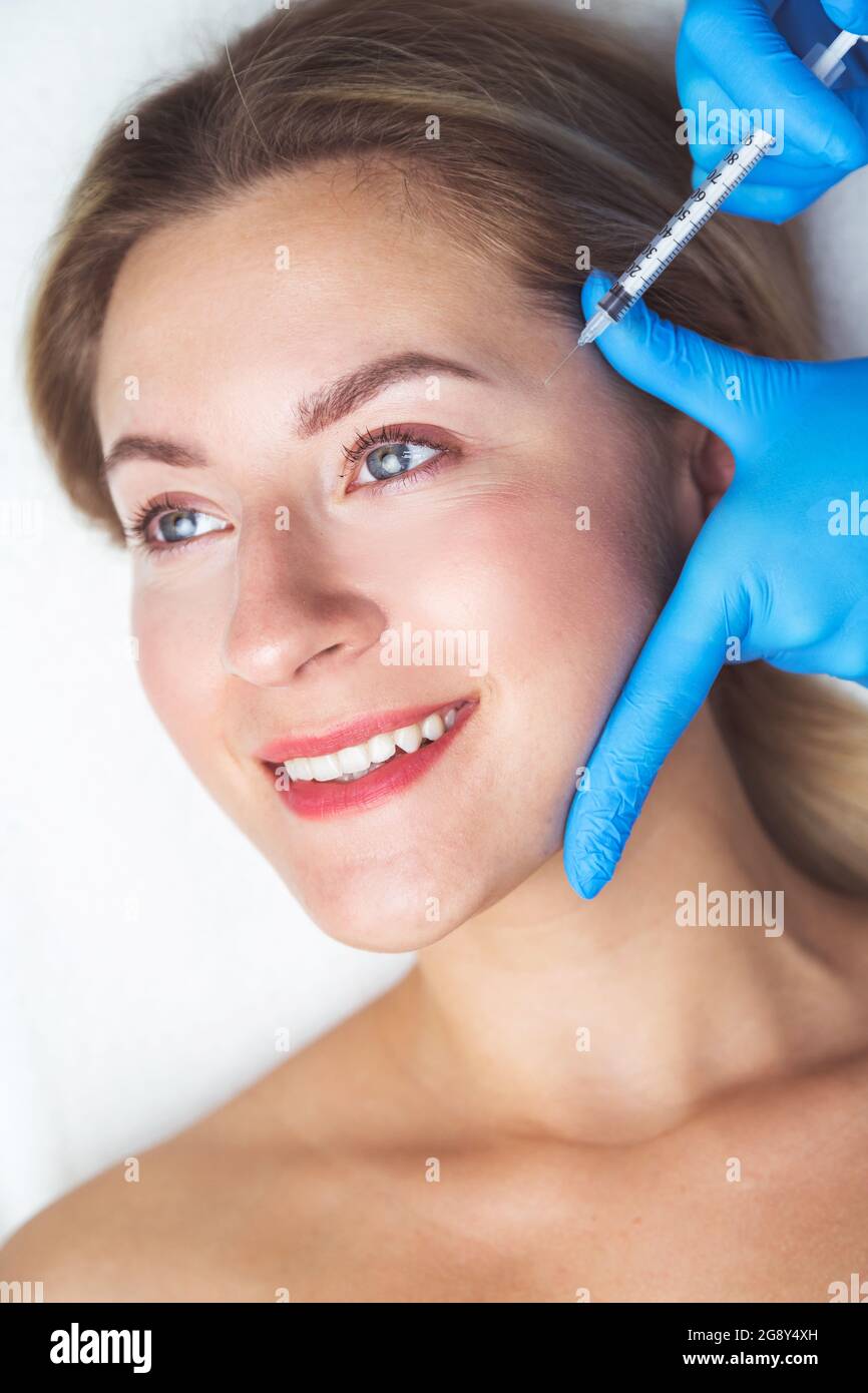 Rejuvenating facial injections procedure for tightening and smoothing ...