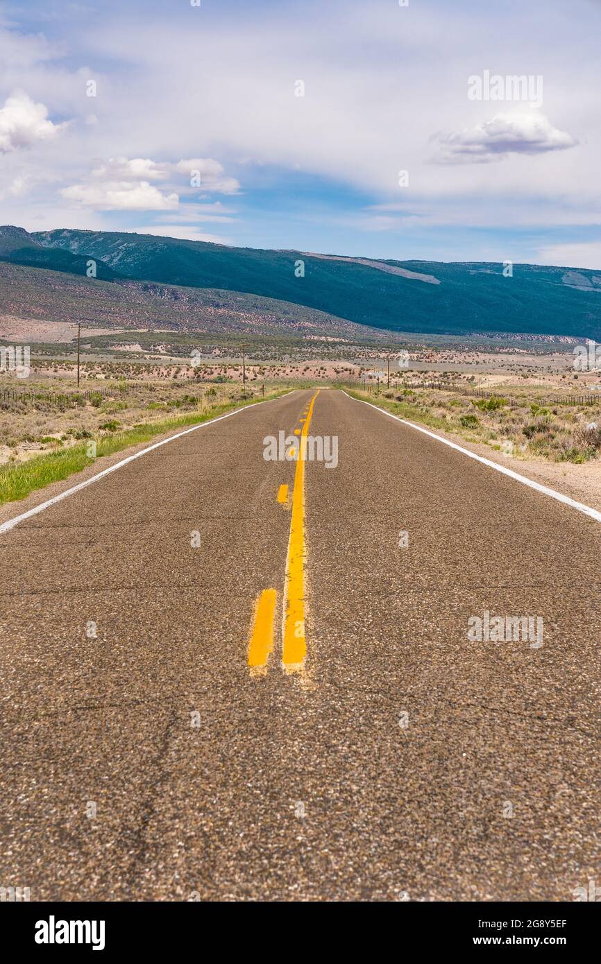 Long straight road in the mountain wilderness Stock Photo - Alamy