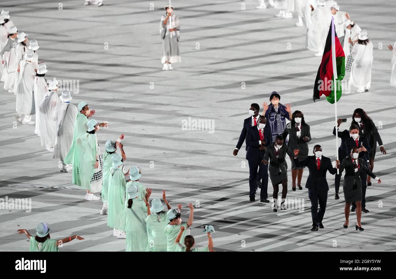 The Malawi team walk out lead by flagbearers Jessica Makwenda and ...