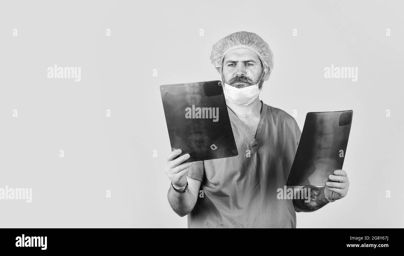 X-ray concept. X ray radiation. The doctor holds pictures of bones ...