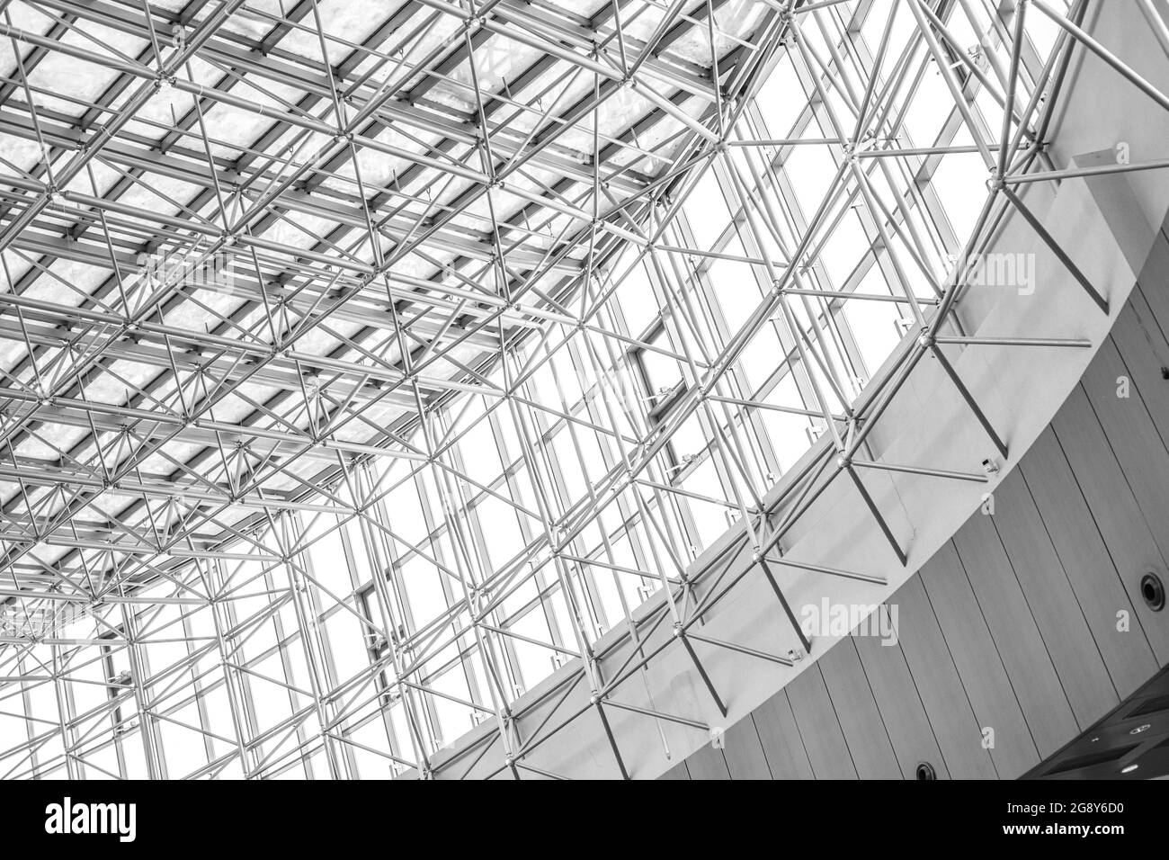 metal ceiling construction of a large tall building, black and white ...