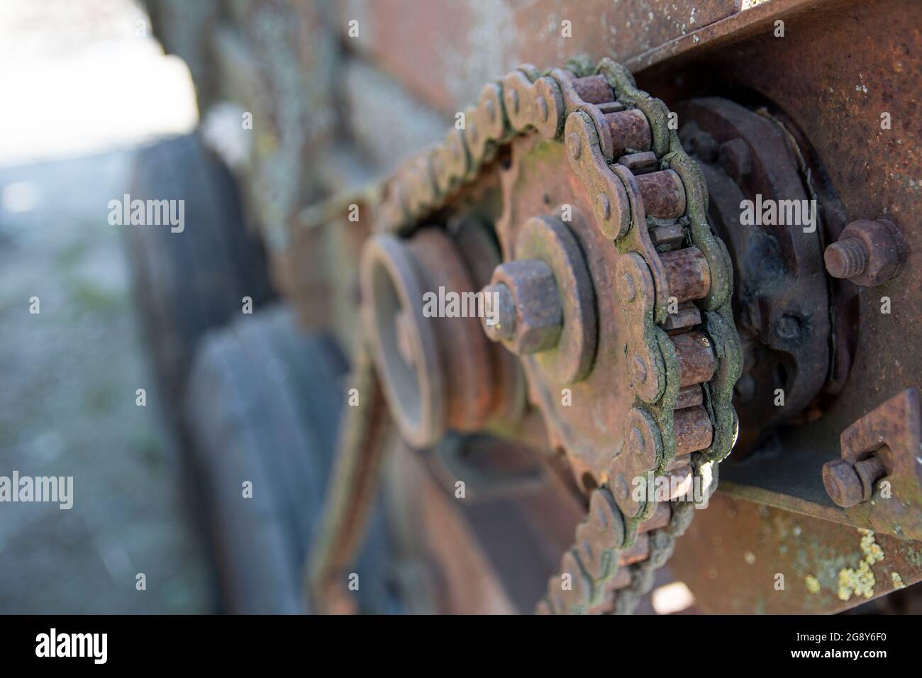 Rusty details of old abandoned cars. Gears, chains, pulleys rust in the ...