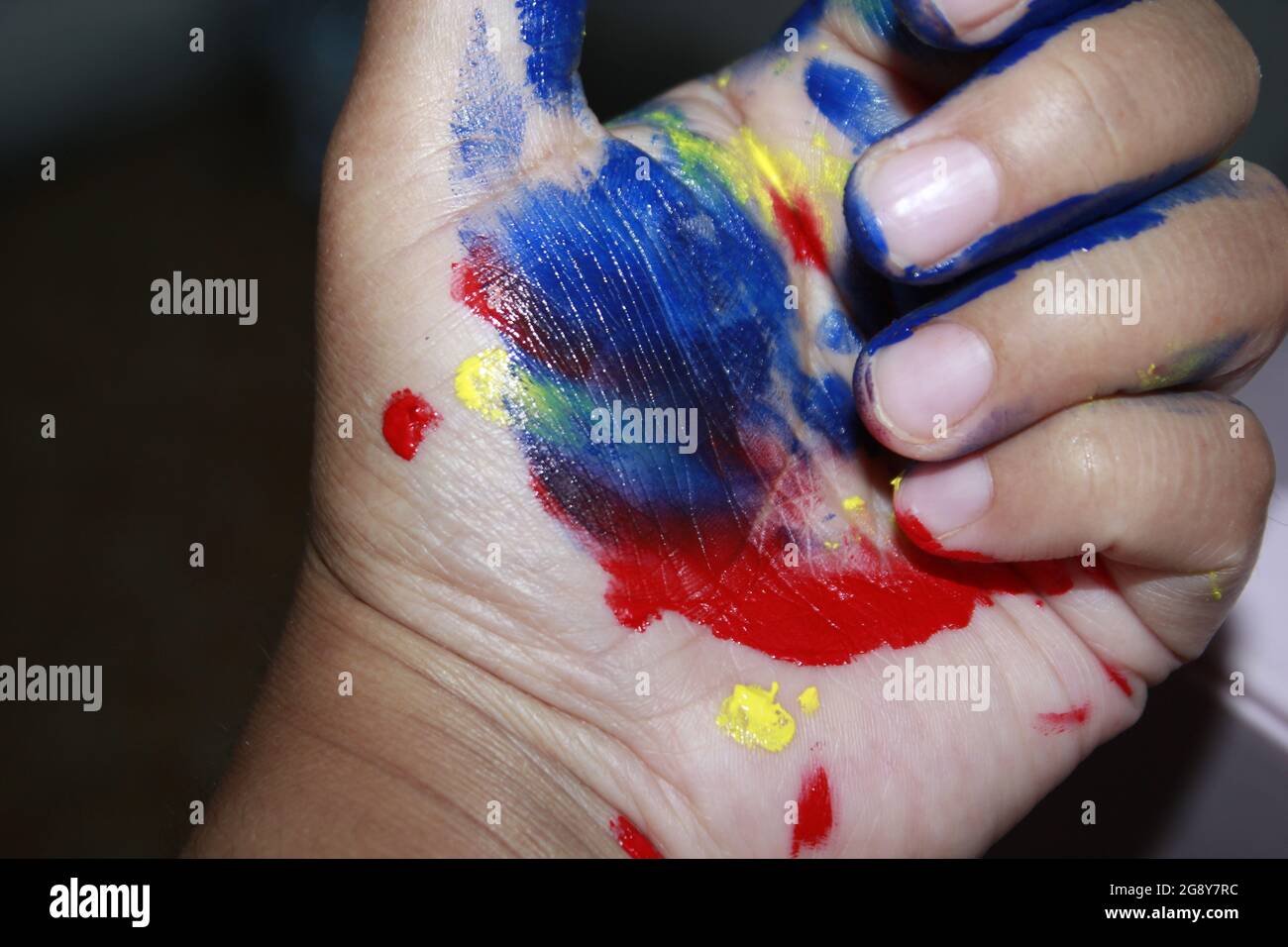 Holidays Colorful a lady's hand on white background Stock Photo - Alamy