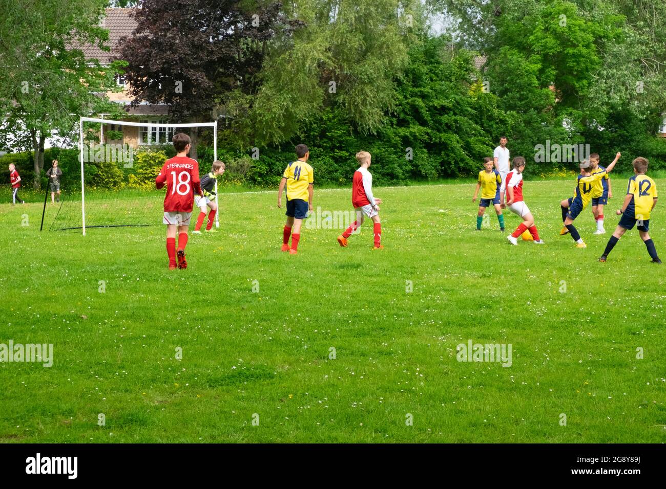 Boys teams playing football on Saturday morning in UK Great Britain ...