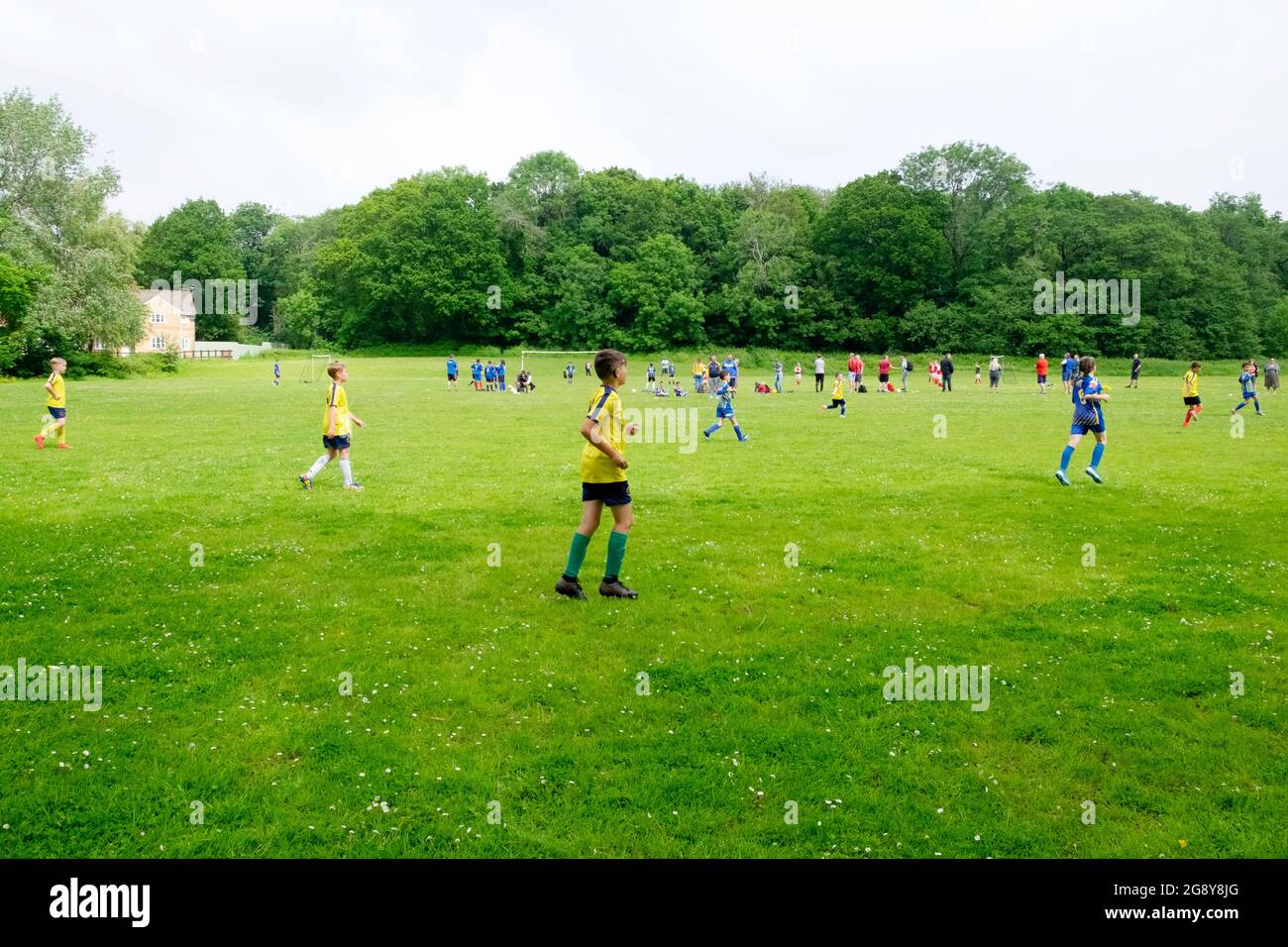 Children playing football field hi-res stock photography and images - Alamy