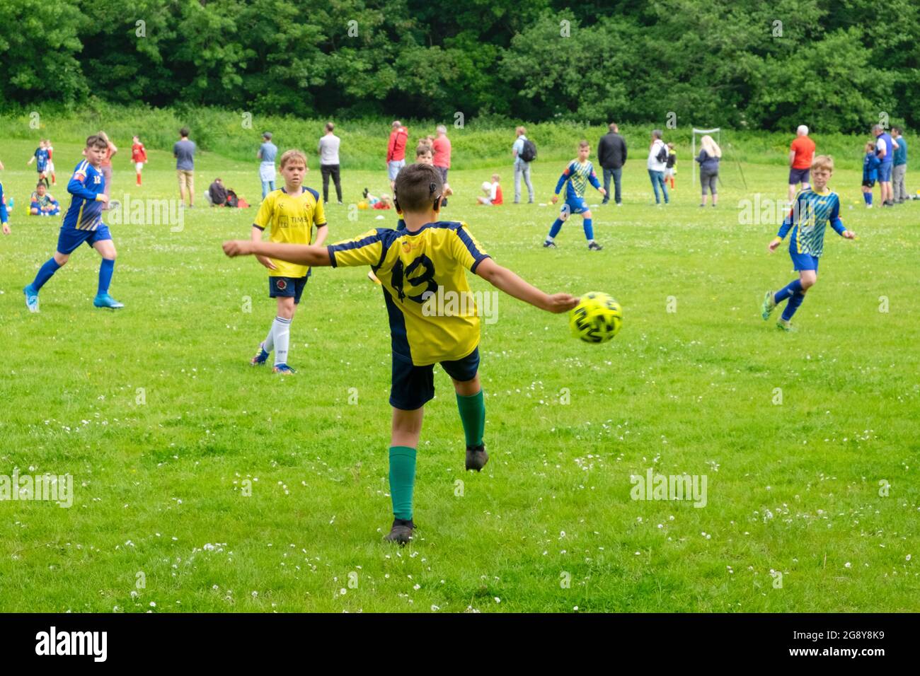 Back rear boy team player kick kicks kicking ball boys teams play ...