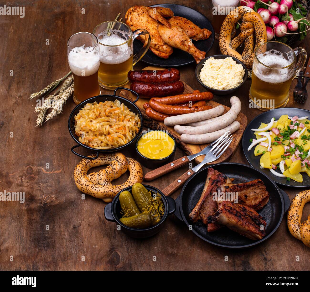 Oktoberfest dishes with beer, pretzel and sausage Stock Photo - Alamy
