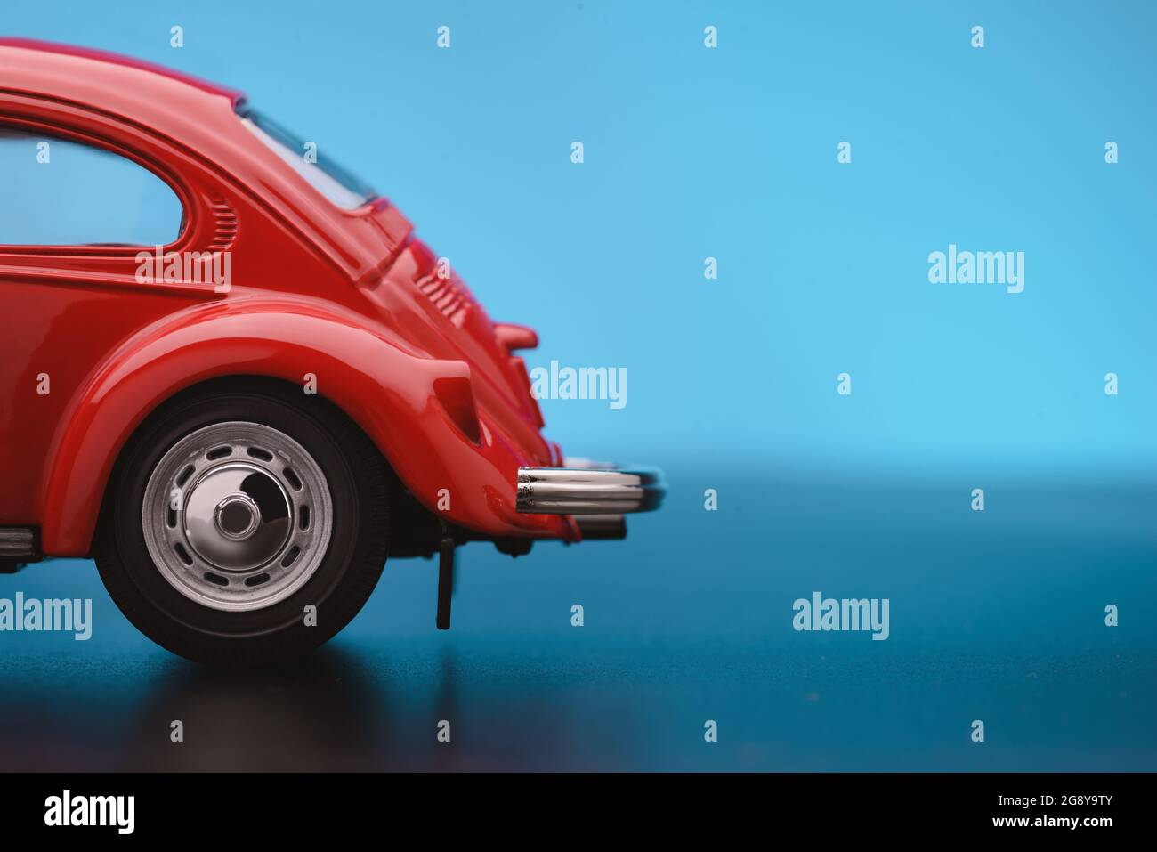 Close up shot of a Partial Backside of a red colored toy model car on a ...