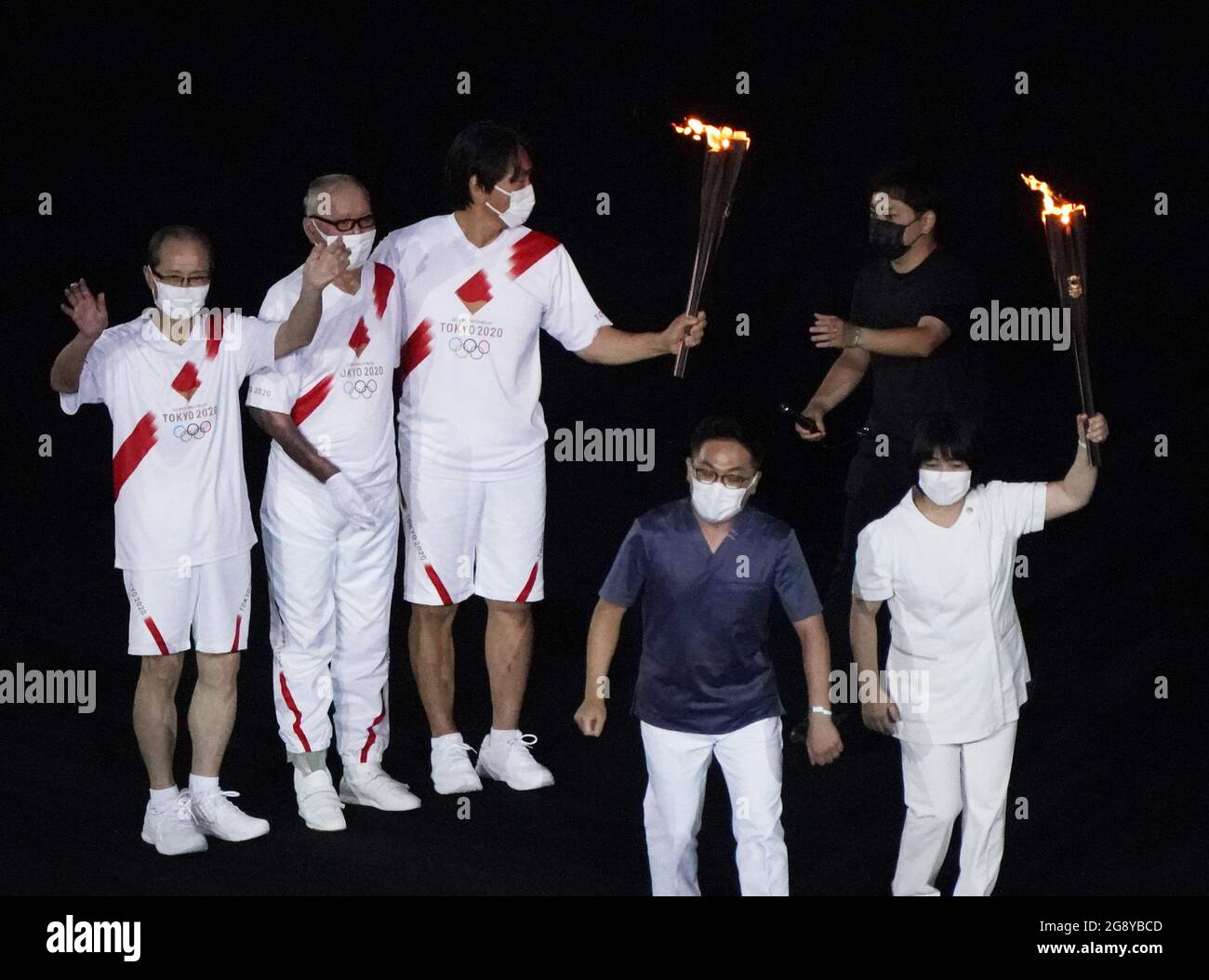 Tokyo, Japan. 23rd July, 2021. Olympic torches are carried at the ...