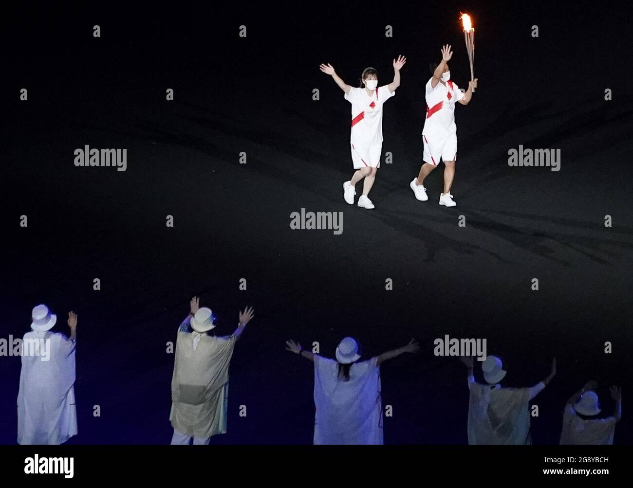 Tokyo, Japan. 23rd July, 2021. Olympic torches are carried at the ...