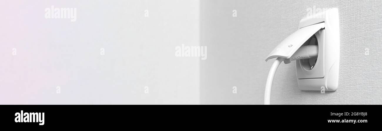 Banner with electrical plug in the electric socket on a wall, interior ...