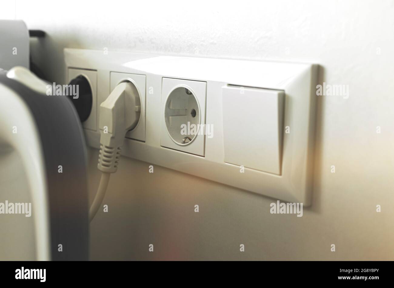 Kitchen electricity concept background with electric outlet on wall and ...