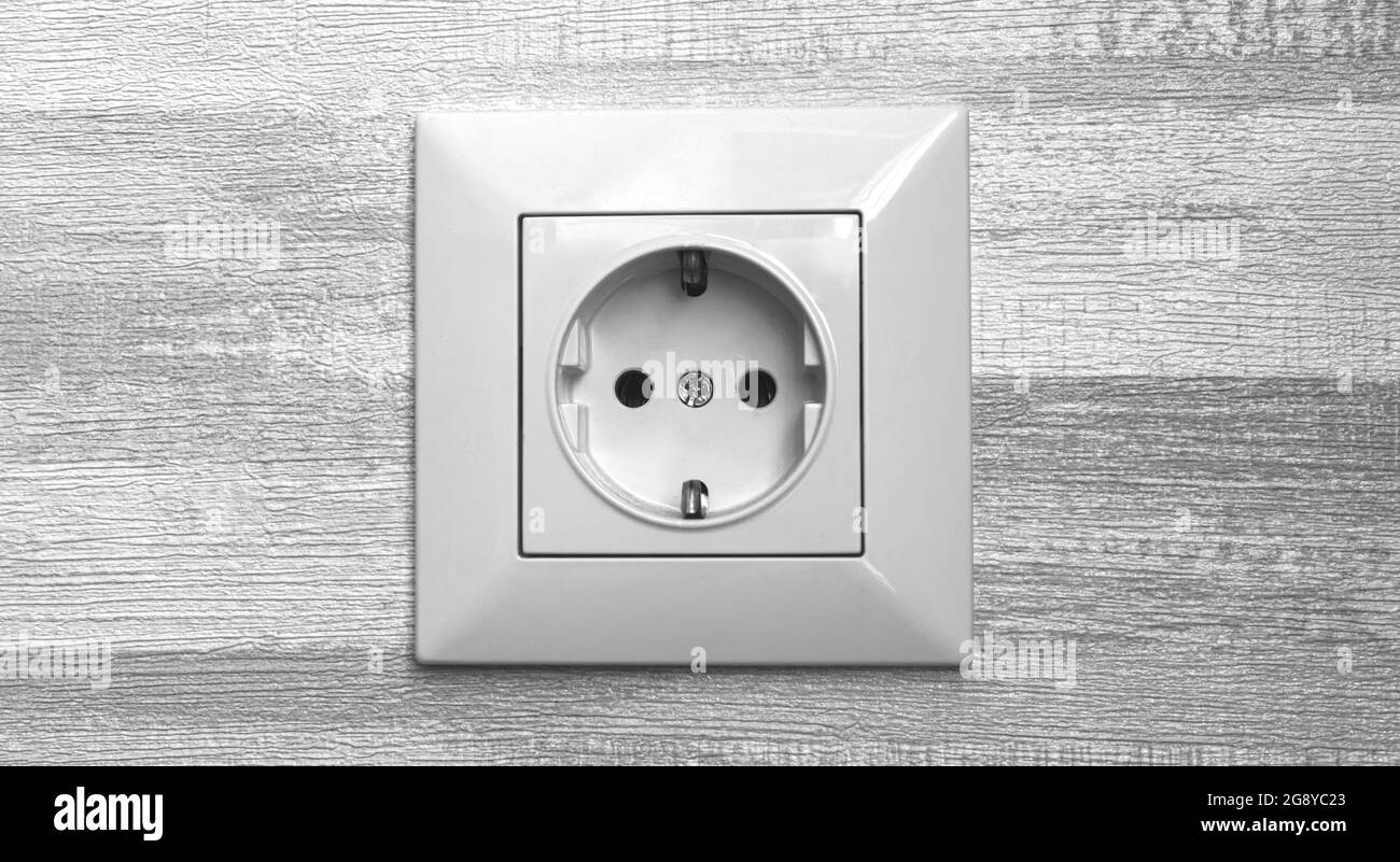 Electric socket on gray wall close-up, EU socket in modern interior ...