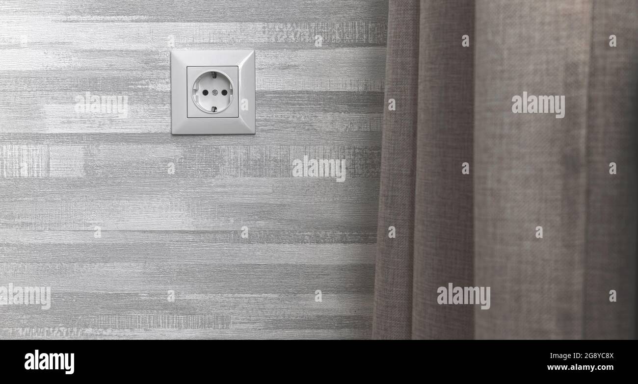 EU Electric outlet on gray wall in modern interior photo Stock Photo ...