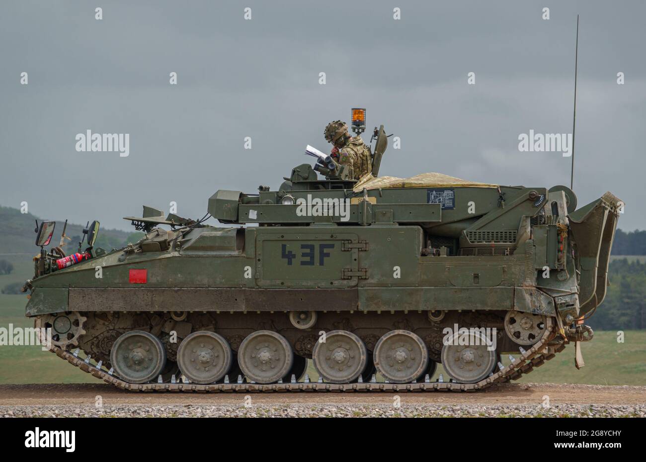 British army Warrior FV512 mechanized recovery vehicle tank in action ...