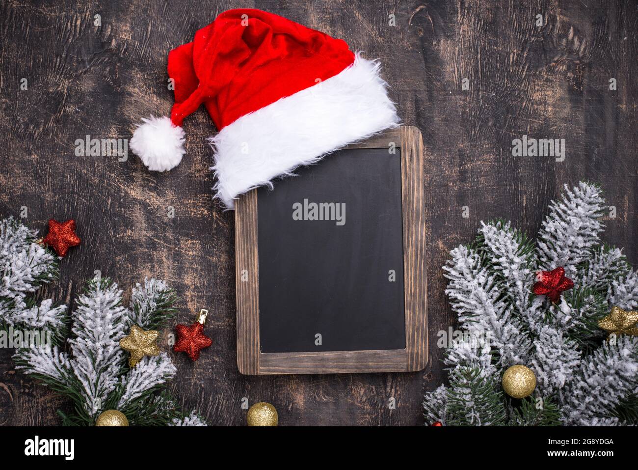 Christmas dark background with Santa hat Stock Photo - Alamy