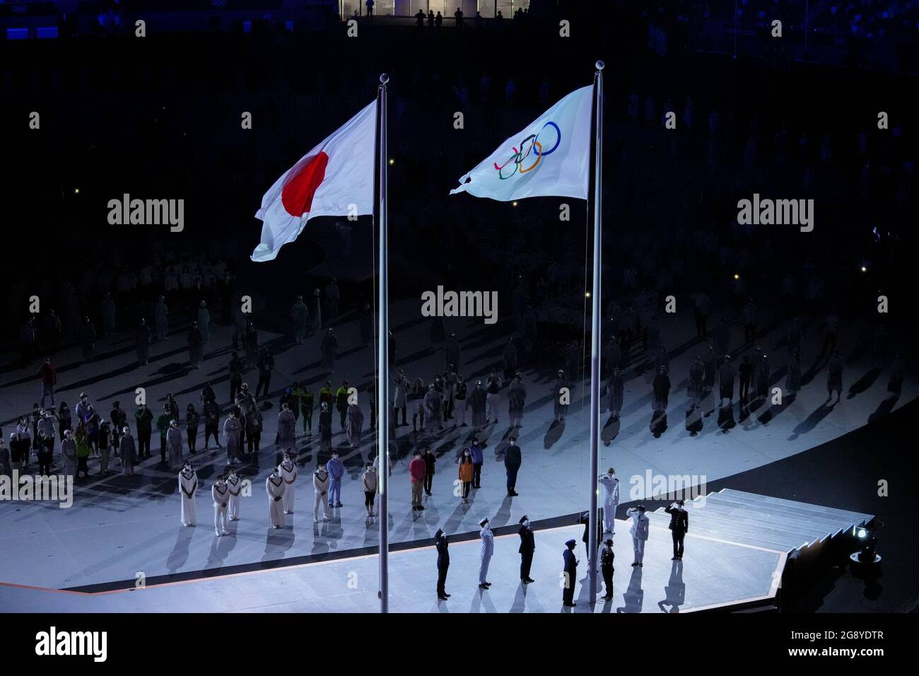 TOKYO, JAPAN - JULY 23: The Olympic flag is raised during the Opening ...