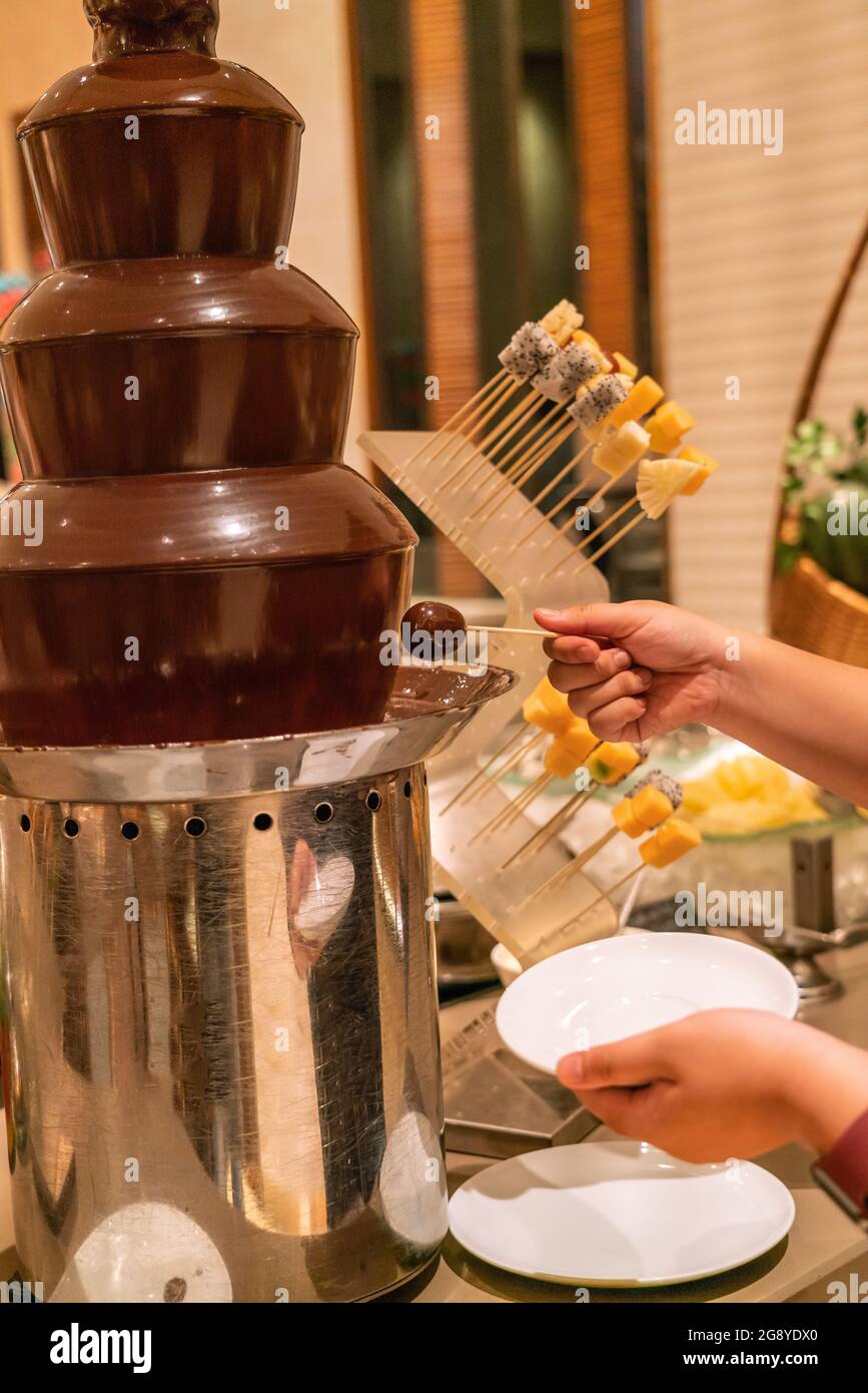 Woman dipping delicious chocolate hi-res stock photography and images ...