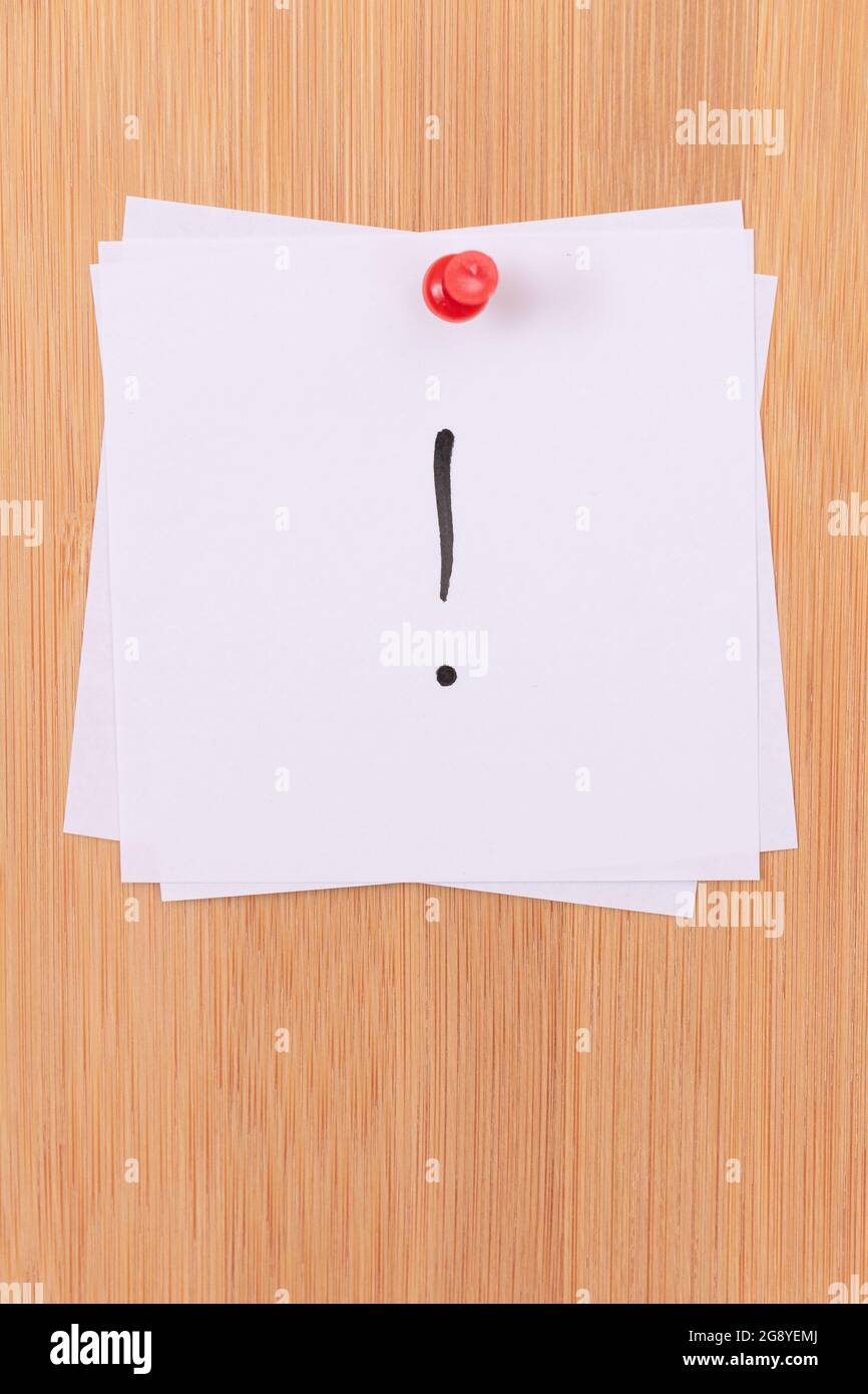 White Sticky Notes with Exclamation Point Pinned to the Wooden Message ...