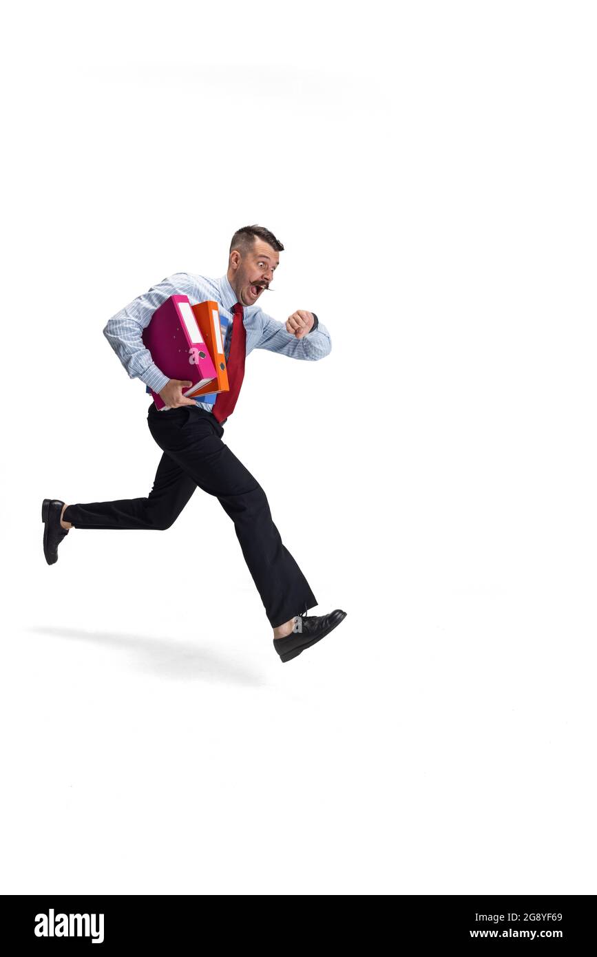 Being late. Portrait of young Caucasian man, office worker running ...
