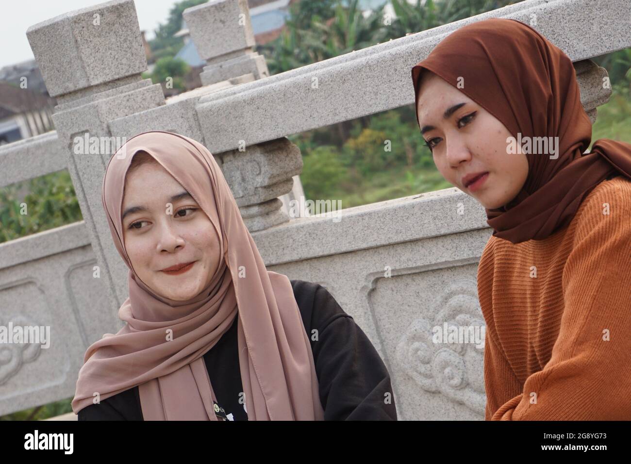 Two beautiful moslem girls with a natural background. The girls ...