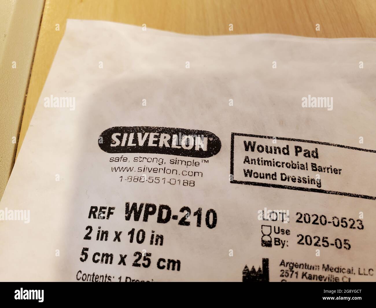 Close-up shot of the packaging for the Silverlon wound dressing pad in ...