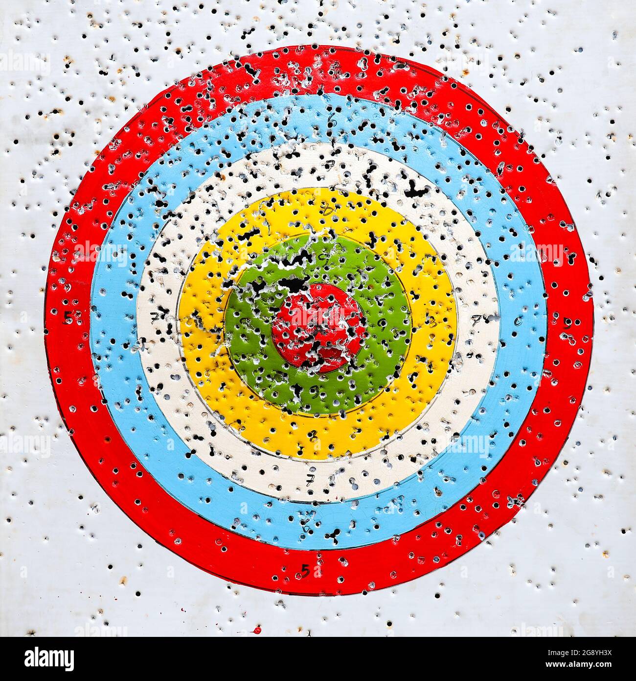 Bright color bullseye target with hundred of hole in all area, concept ...