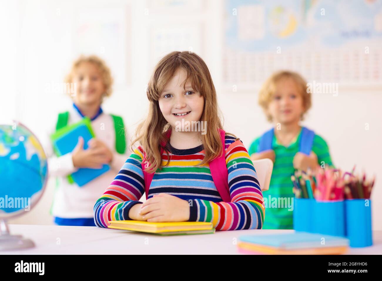 Kids in school. Preschool children in class. Happy kids back to school ...