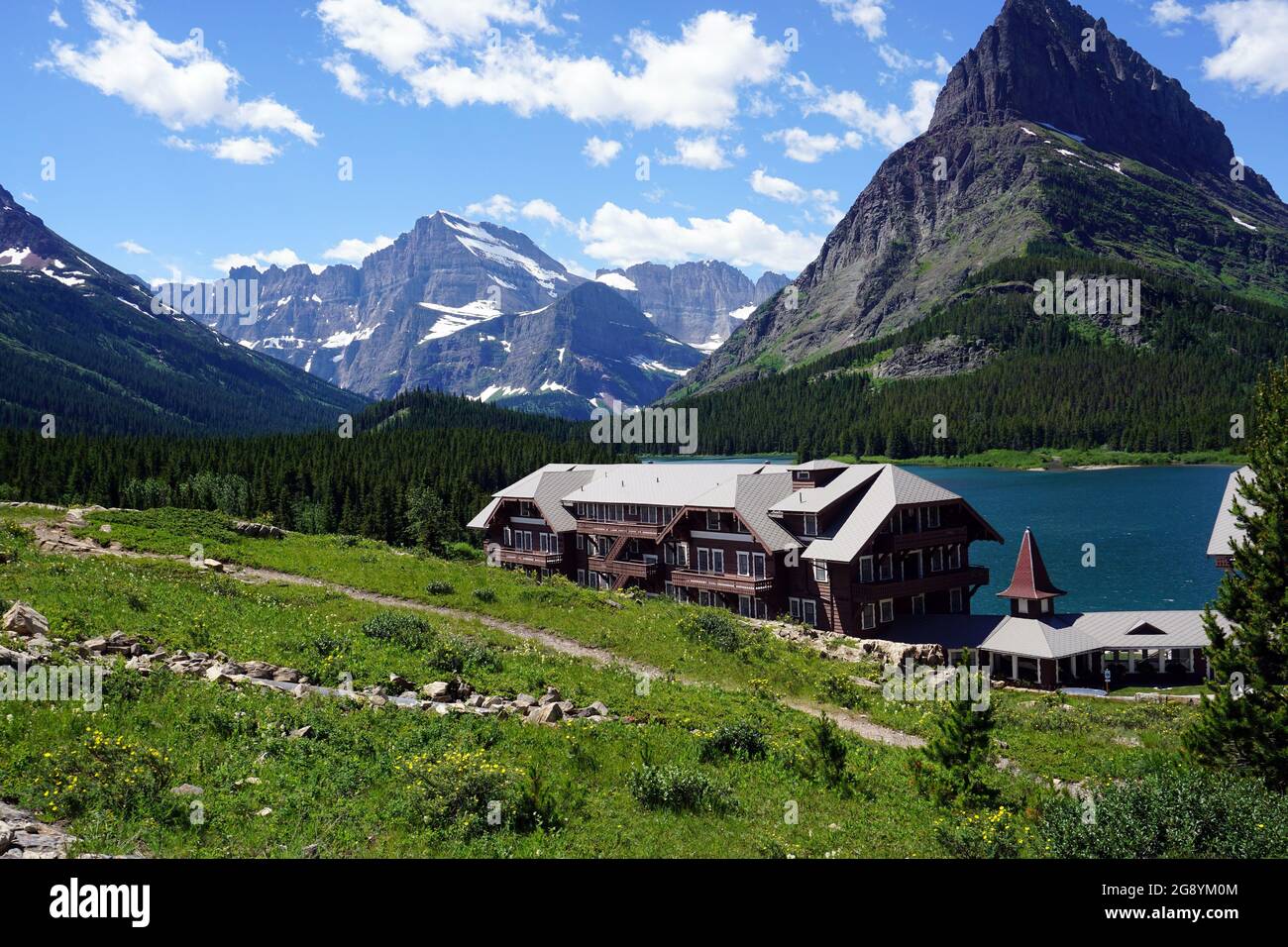 Mini Glacier Hotel on Swiftcurrent Lake, Grinnell Point Peak to the ...