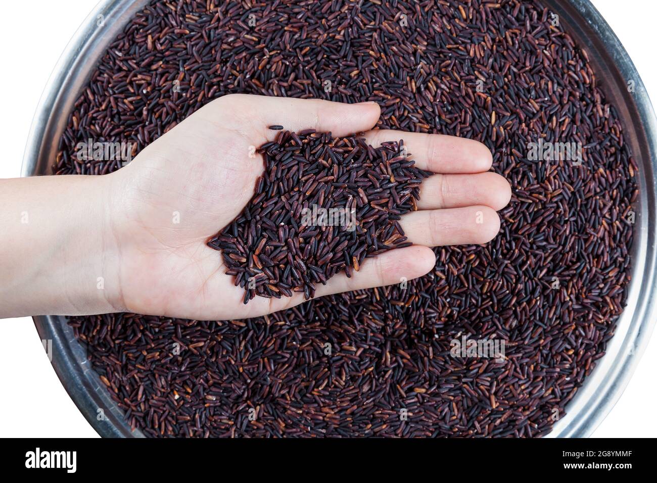 Organic rice heart-shaped on palm of asian woman hand over brown rice ...