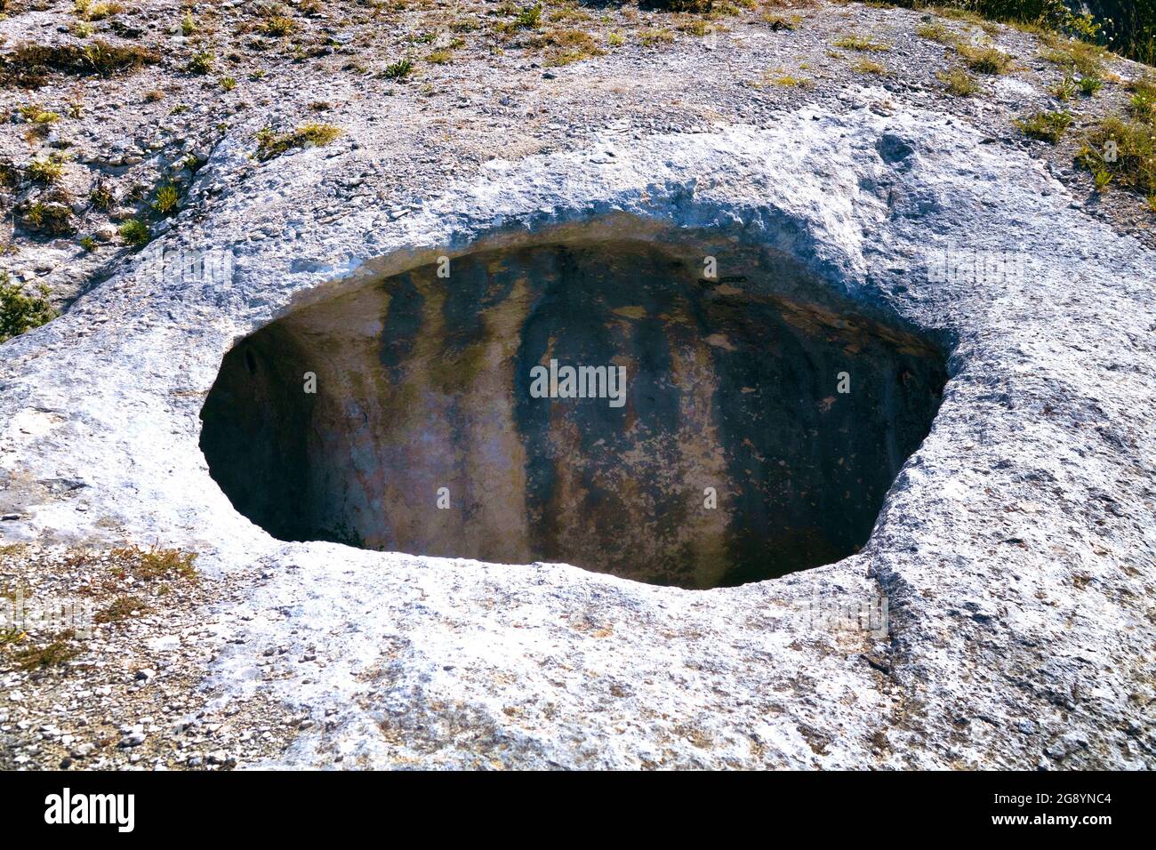 Entrance to a man-made cave in a limestone rock. A place of refuge for ...