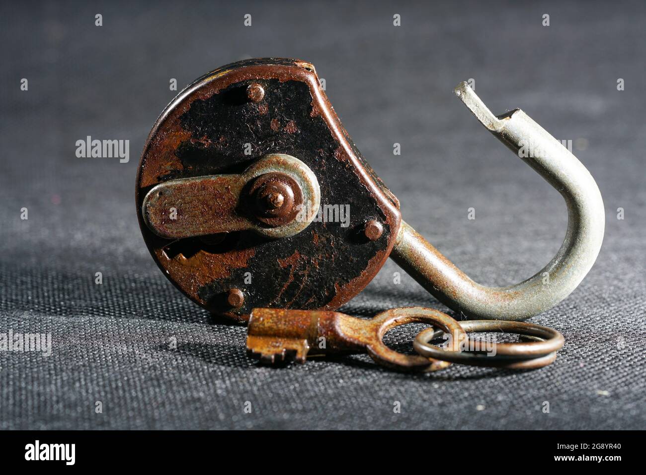 Old padlock with rust but fully functional photographed in the studio ...