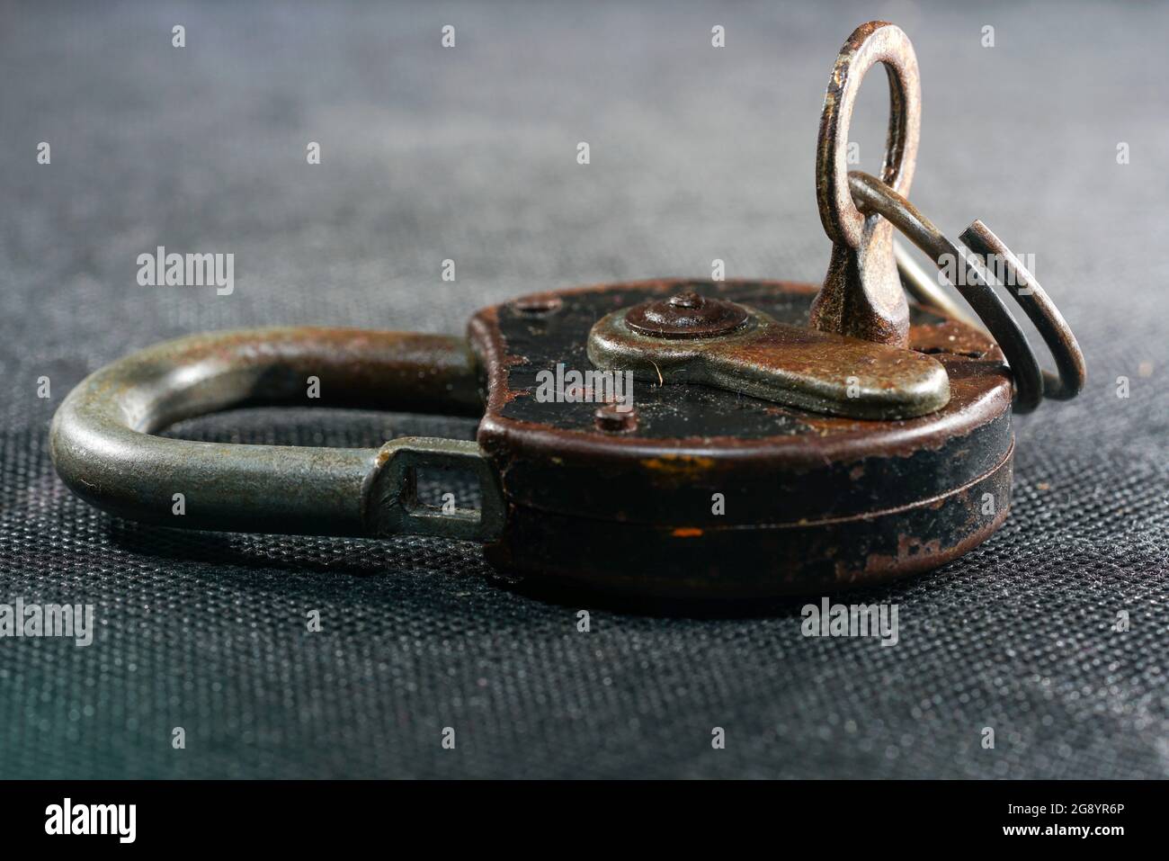 Old padlock with rust but fully functional photographed in the studio ...