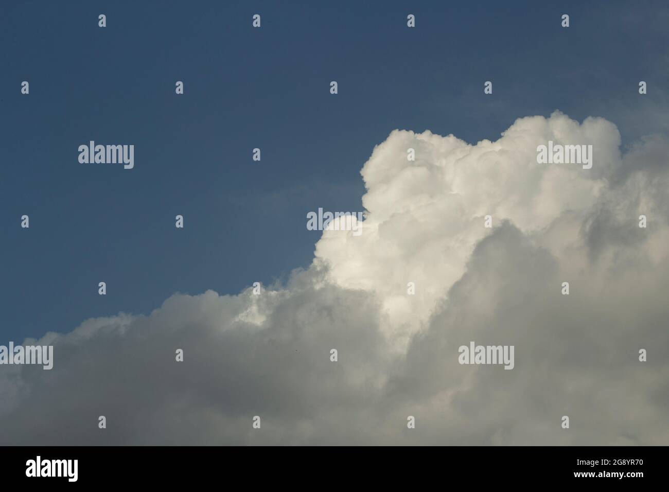 Clouds in the sky. White cumulus cloud close up. Summer weather in the ...