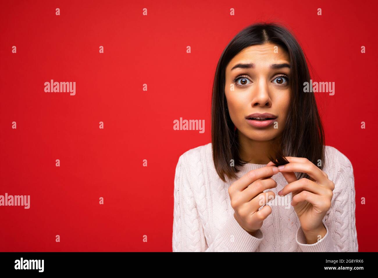 Portrait of attractive shocked amazed young brunette woman wearing ...