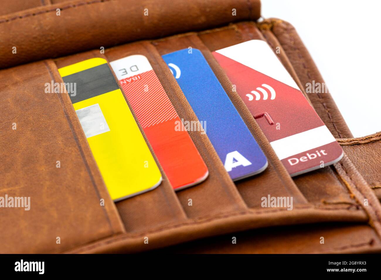 Macro photo of a brown mens leather wallet with debit and credit cards ...