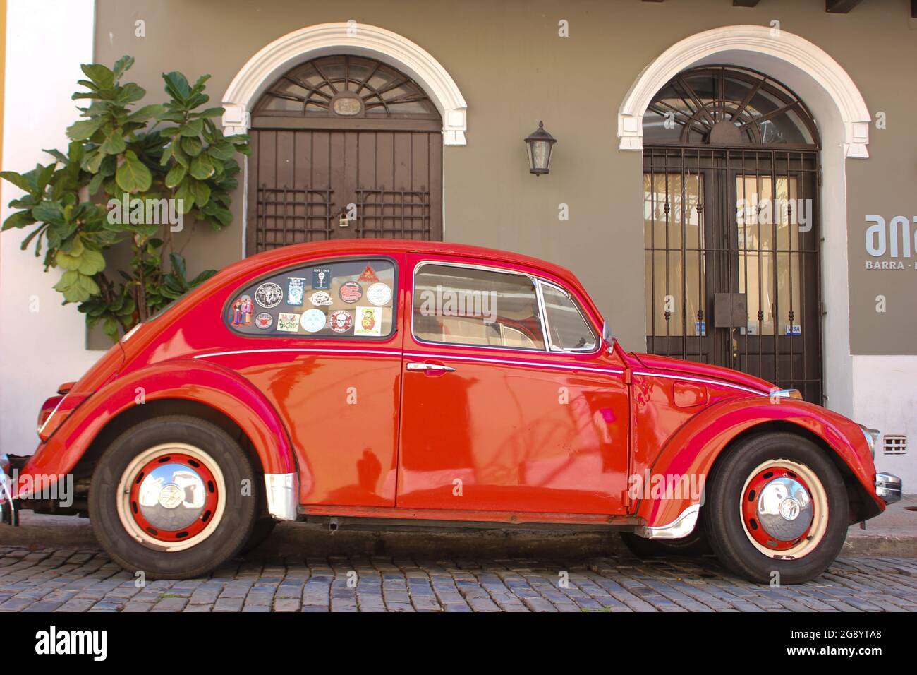 Red car in Street in old San Juan, Puerto Rico, with flag Stock Photo ...