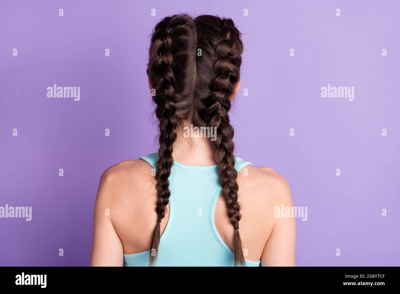 Back view photo of young woman wearing singlet braids isolated on ...