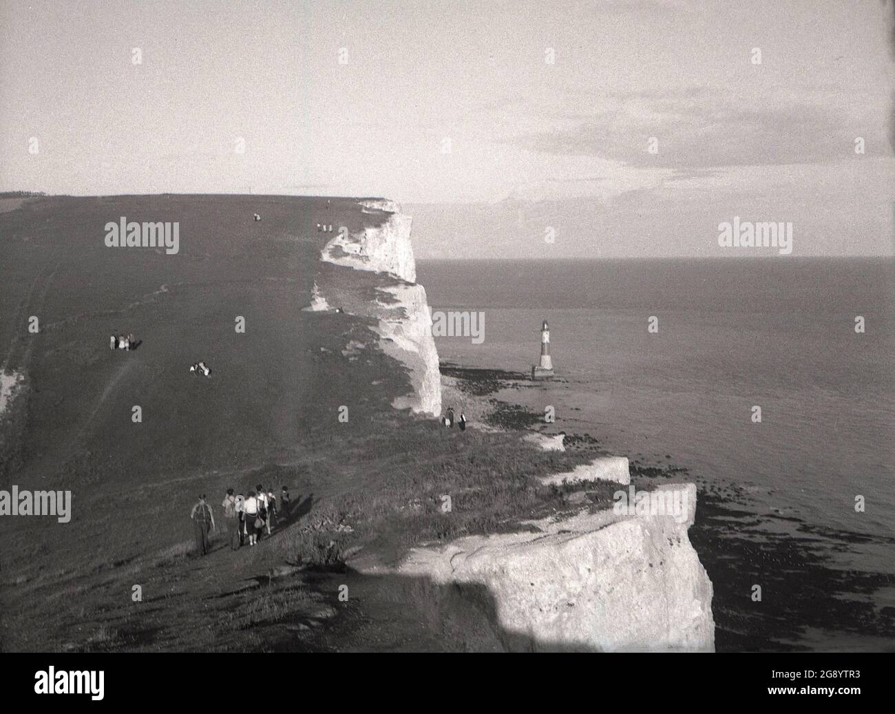 1950s, historical picture , people out walking at Beachy Head, near ...