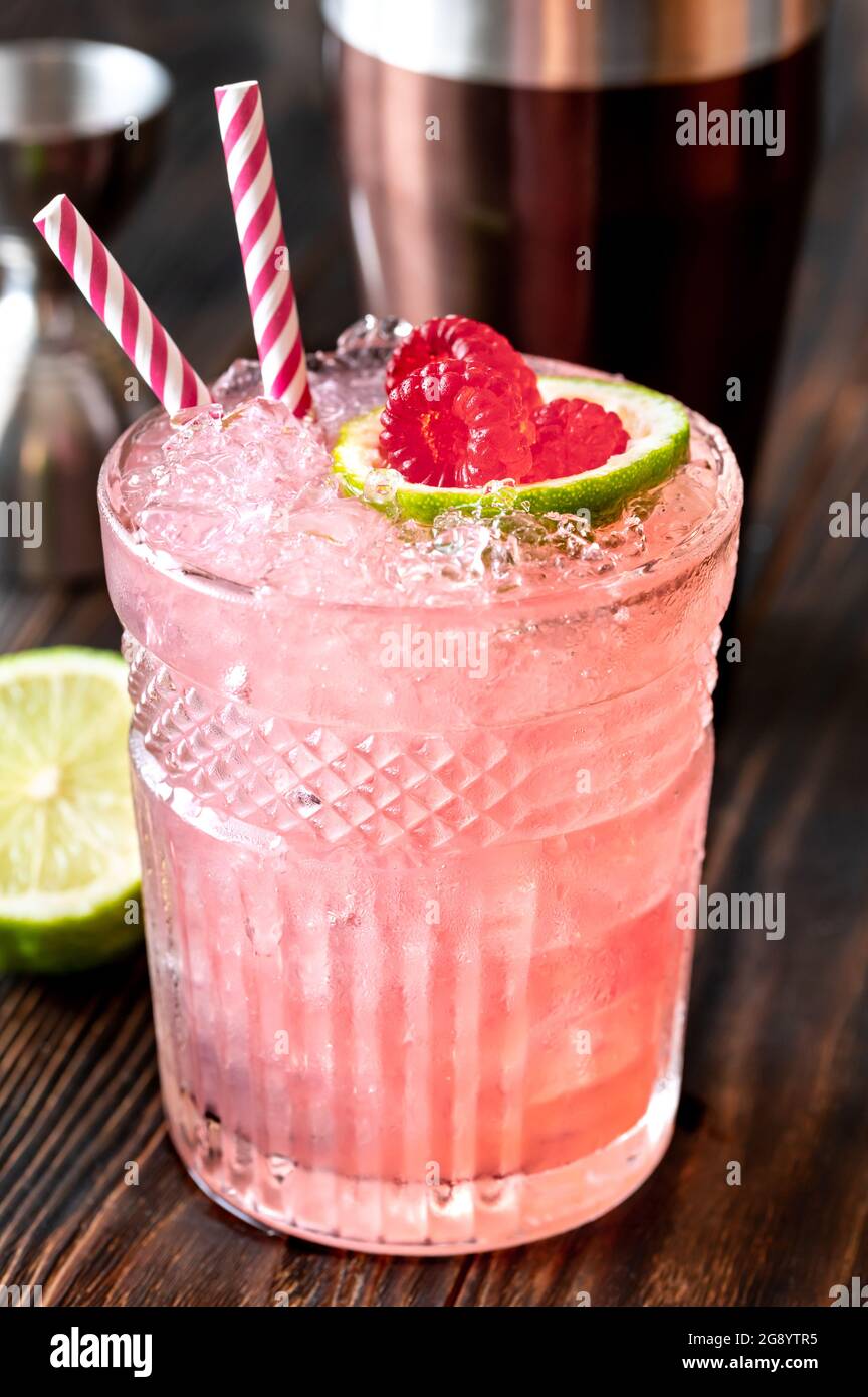 Glass of Knickerbocker cocktail made of rum, lime juice, orange curacao and raspberry syrup ...