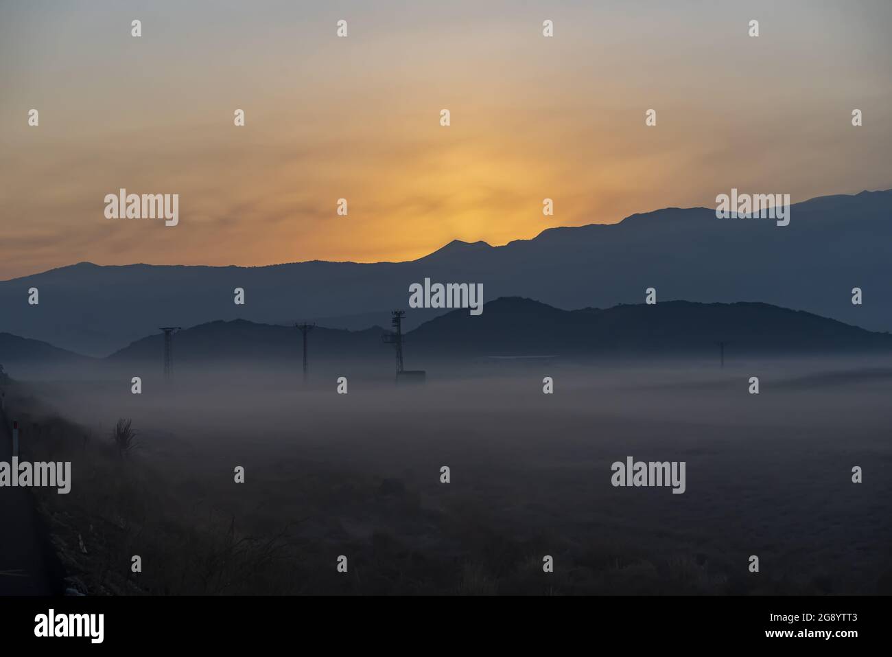 Beautiful sunrise over the Erciyes mountain and calm river on a misty ...