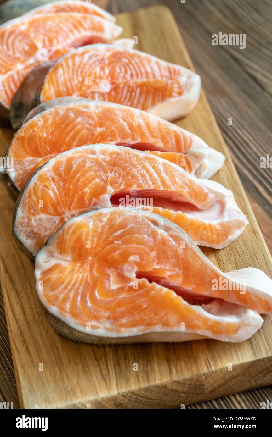Raw steaks of Arctic char on the wooden board Stock Photo - Alamy