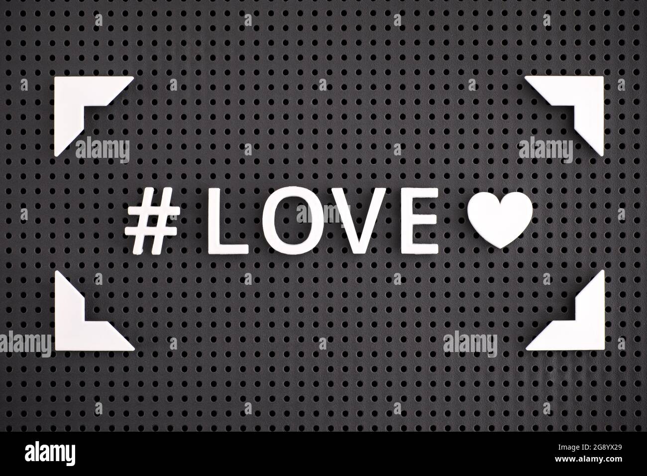 The Hashtag Love with heart spelled out with white letters in a frame ...