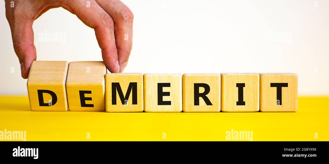 Demerit or merit symbol. Businessman turns wooden cubes and changes ...