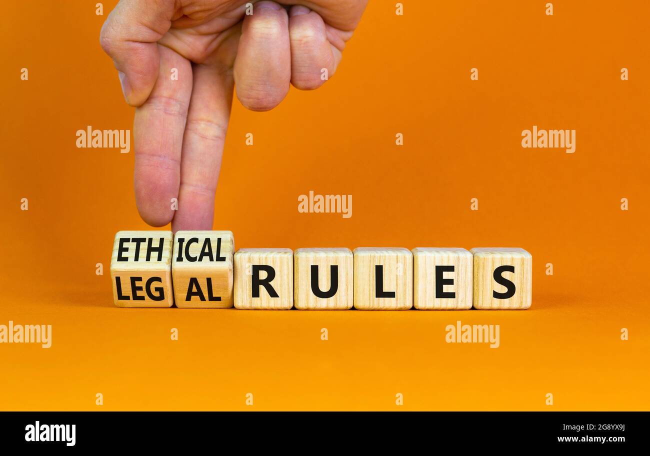Ethical or legal rules symbol. Businessman turns wooden cubes and ...
